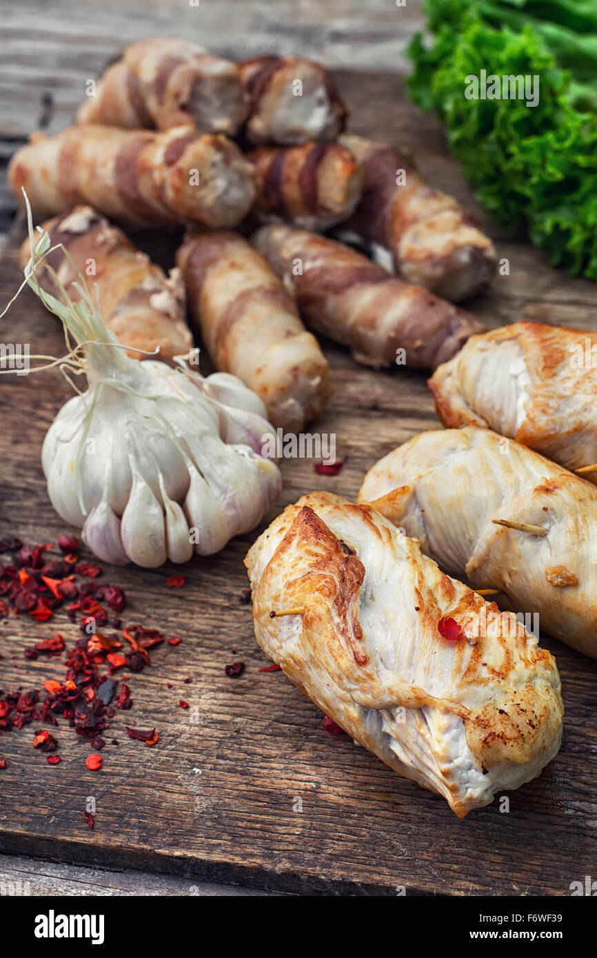 Set of rolled into tube of sausage meat in rustic style Stock Photo - Alamy