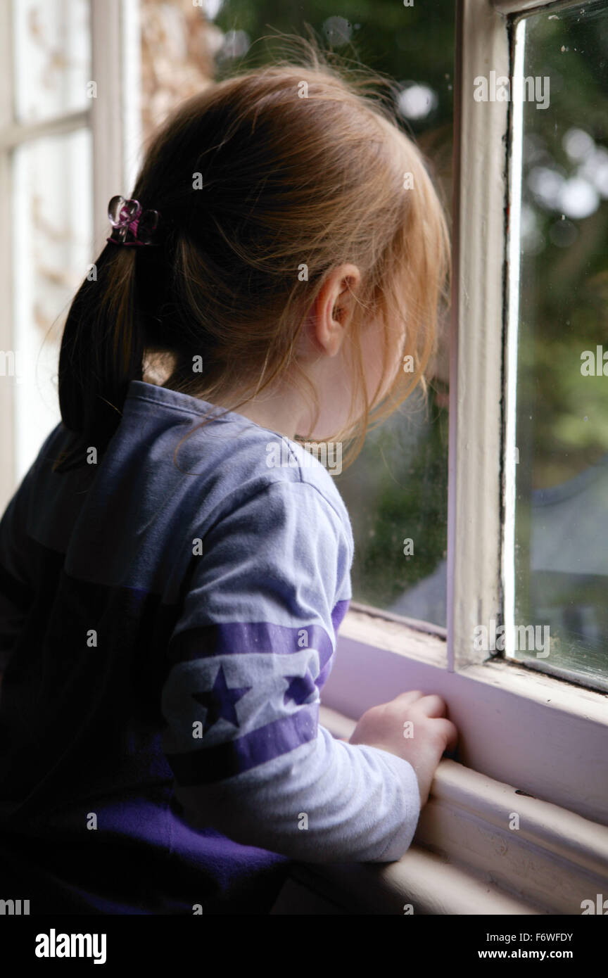Sad Girl Looking Out Window White Stock Photos & Sad Girl Looking Out ...