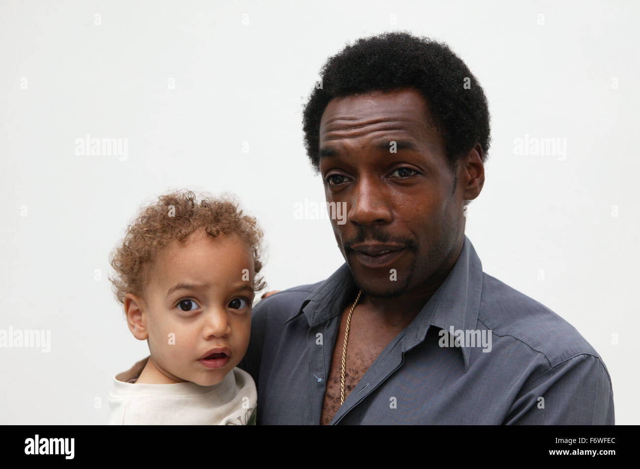 Father holding his young son Stock Photo - Alamy