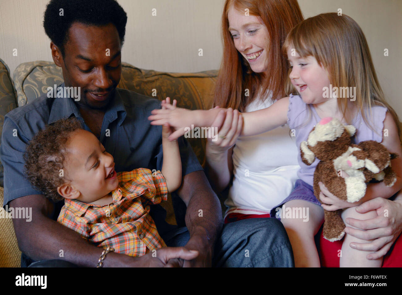 Sitting together group people hi-res stock photography and images - Alamy