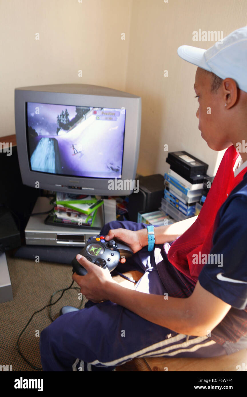 Young teenager playing with computer game Stock Photo - Alamy