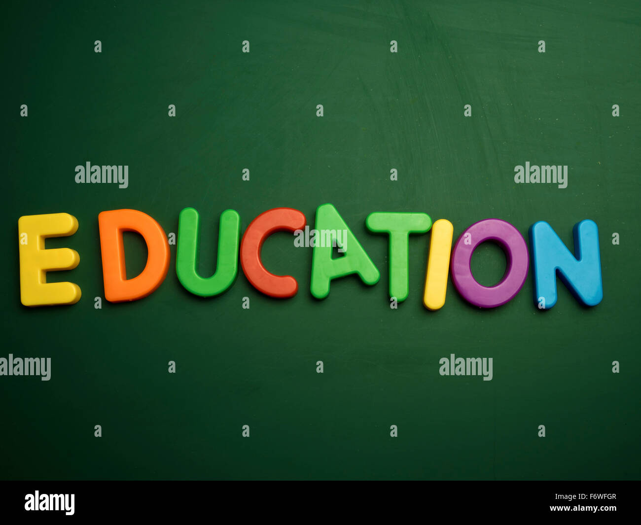 education concept in colorful letters isolated on blank blackboard ...