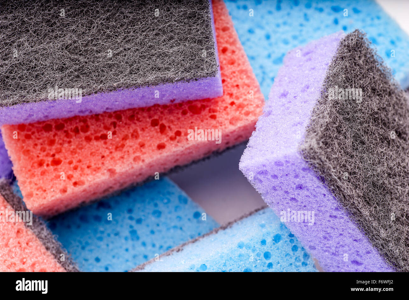 Lots of Cleaning sponges in several colors Stock Photo - Alamy