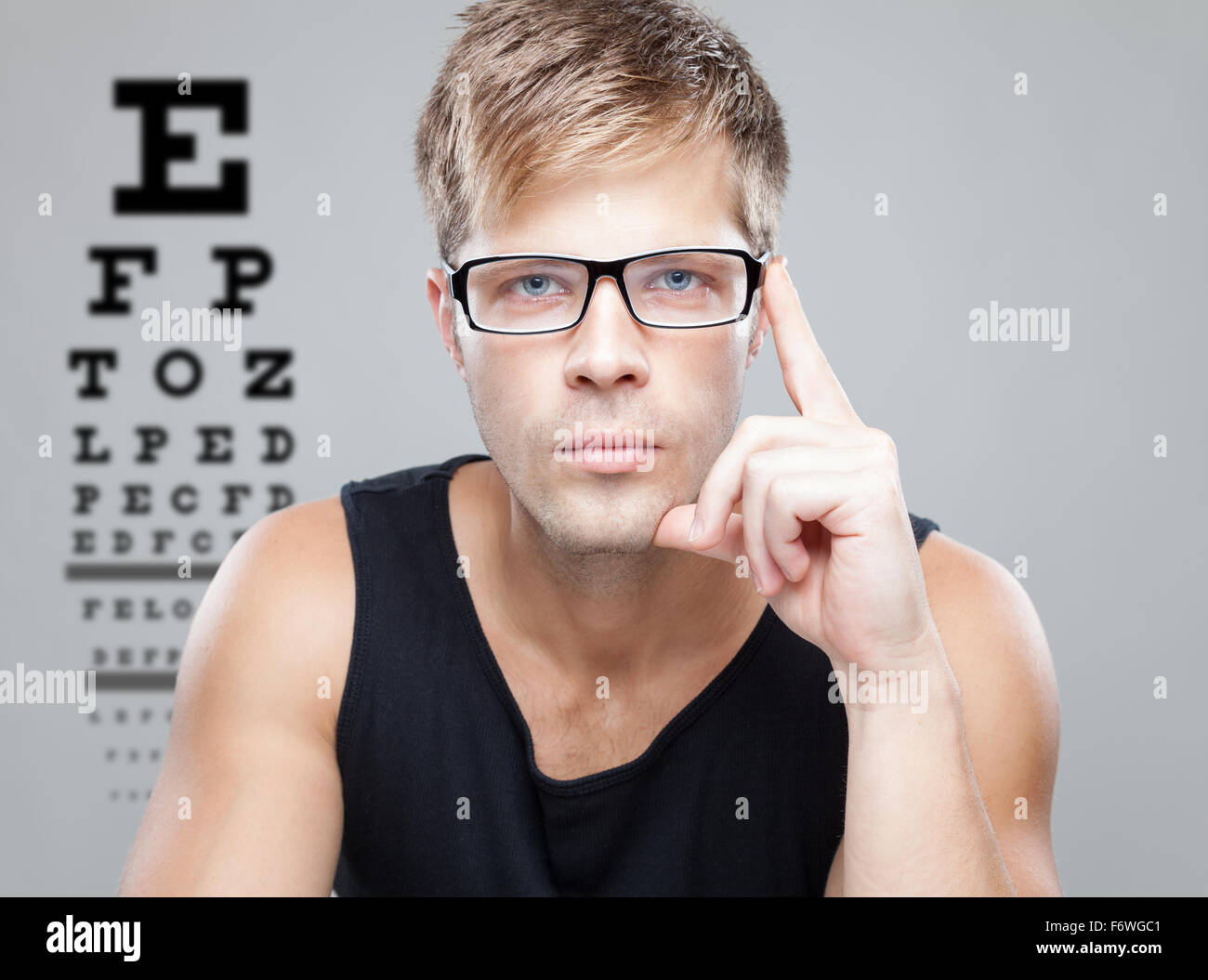 Handsome young man wearing glasses Stock Photo - Alamy