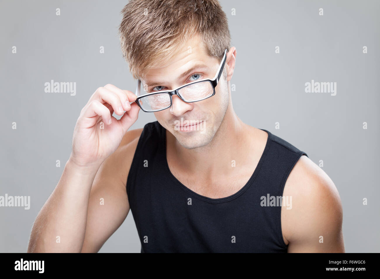 Handsome young man wearing glasses Stock Photo - Alamy