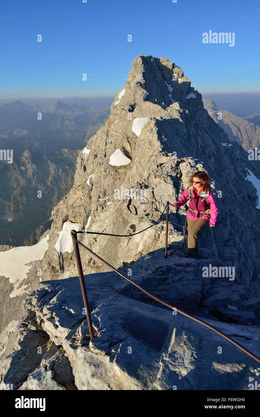 Woman ascending alongside fixed ropes to Watzmann, Watzmann ridge and ...