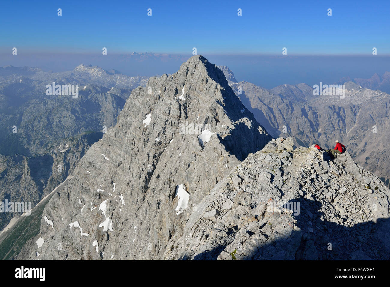 Man sitting on ridge and looking towards Suedspitze of Watzmann, at ...