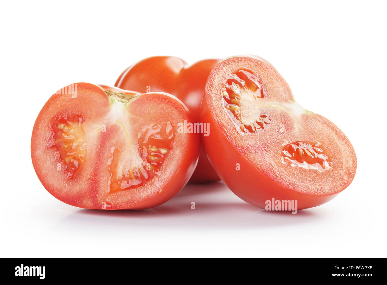 big beef tomatoes sliced, isolated on white Stock Photo - Alamy