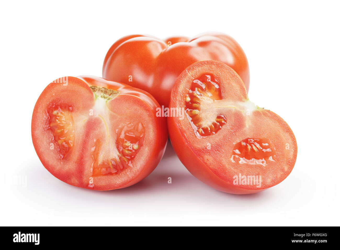 big beef tomatoes sliced, isolated on white Stock Photo - Alamy