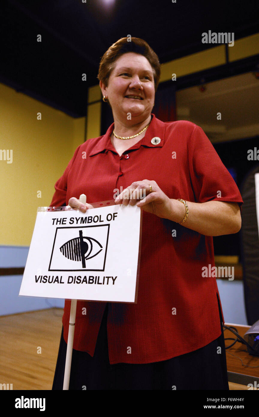 Disabled woman speaker at Disability Awareness Forum; showing a visual ...