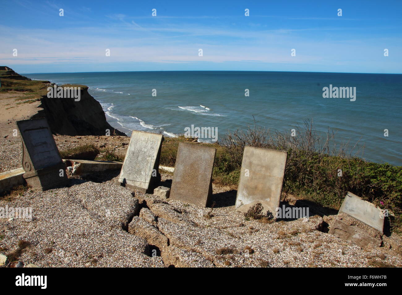 Ancient Headstone at Edge of Cliff with Erosion Cracks Stock Photo - Alamy