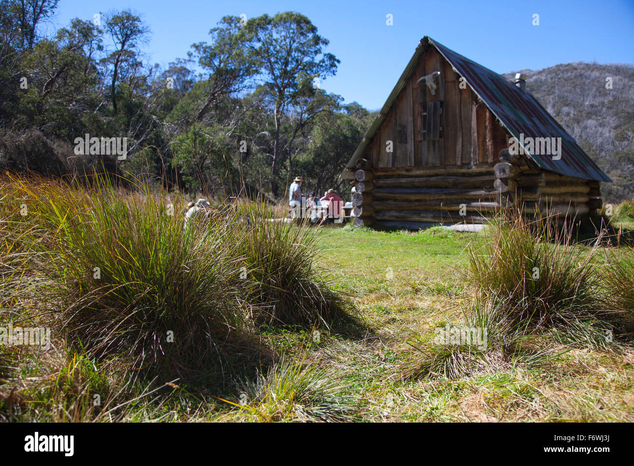 Hikers resting at Dibbin Hut, Alpine National Park, Victoria, Australia ...