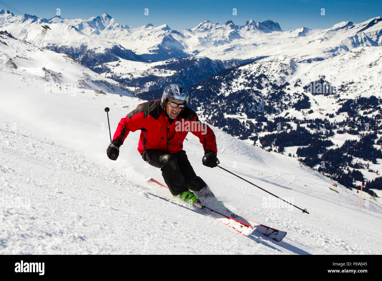 Skier downhill skiing from mount Parpaner Rothorn, Lenzerheide, Canton ...