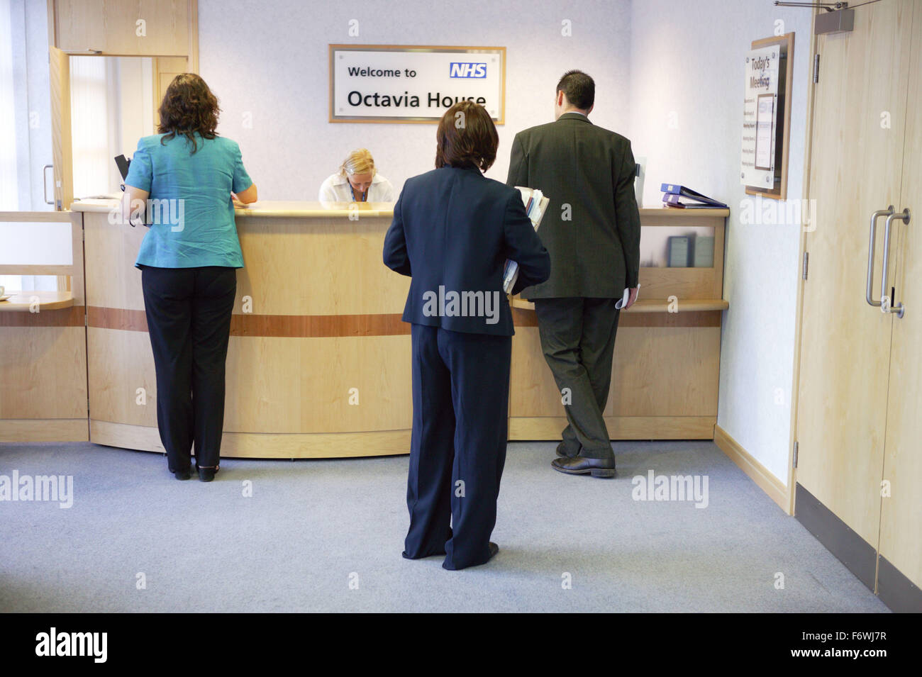 Group waiting in the reception area of NHS Octavia House Stock Photo ...