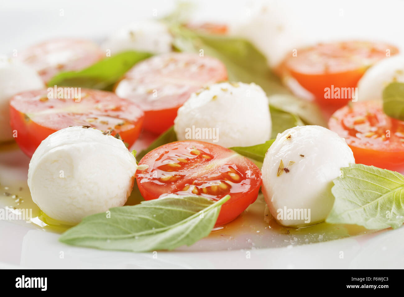 caprese salad with mini mozzarella balls and tomatoes Stock Photo - Alamy