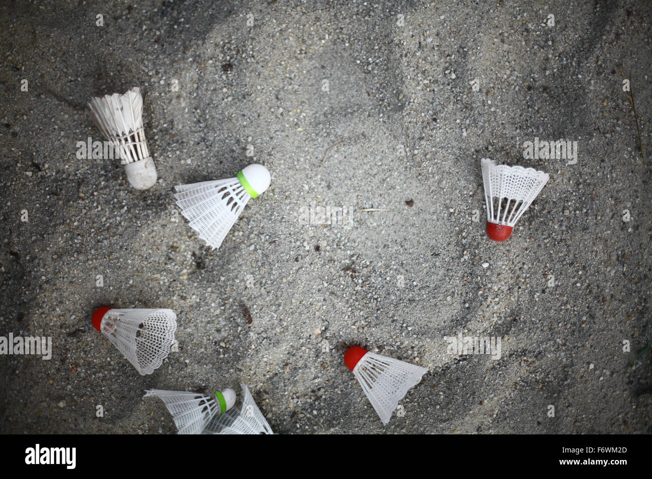 Color image of some shuttlecocks in the sand Stock Photo - Alamy