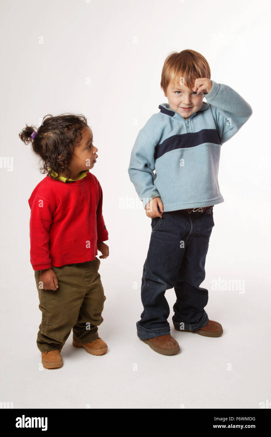 Young boys standing in a studio Stock Photo - Alamy