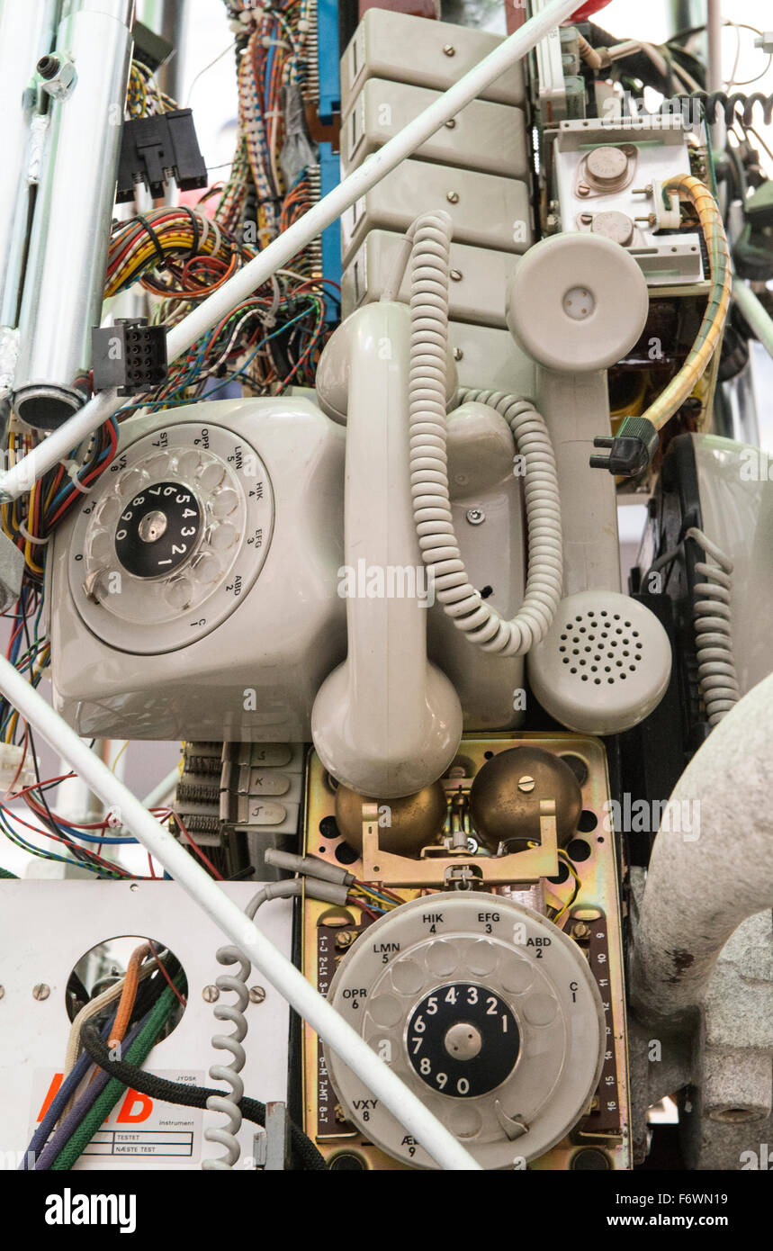 Chaotic set old telephone and communication equipment Stock Photo - Alamy