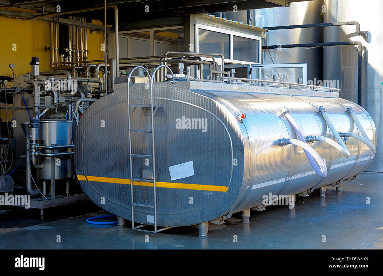 Large stainless steel tank containing milk located in a dairy food ...