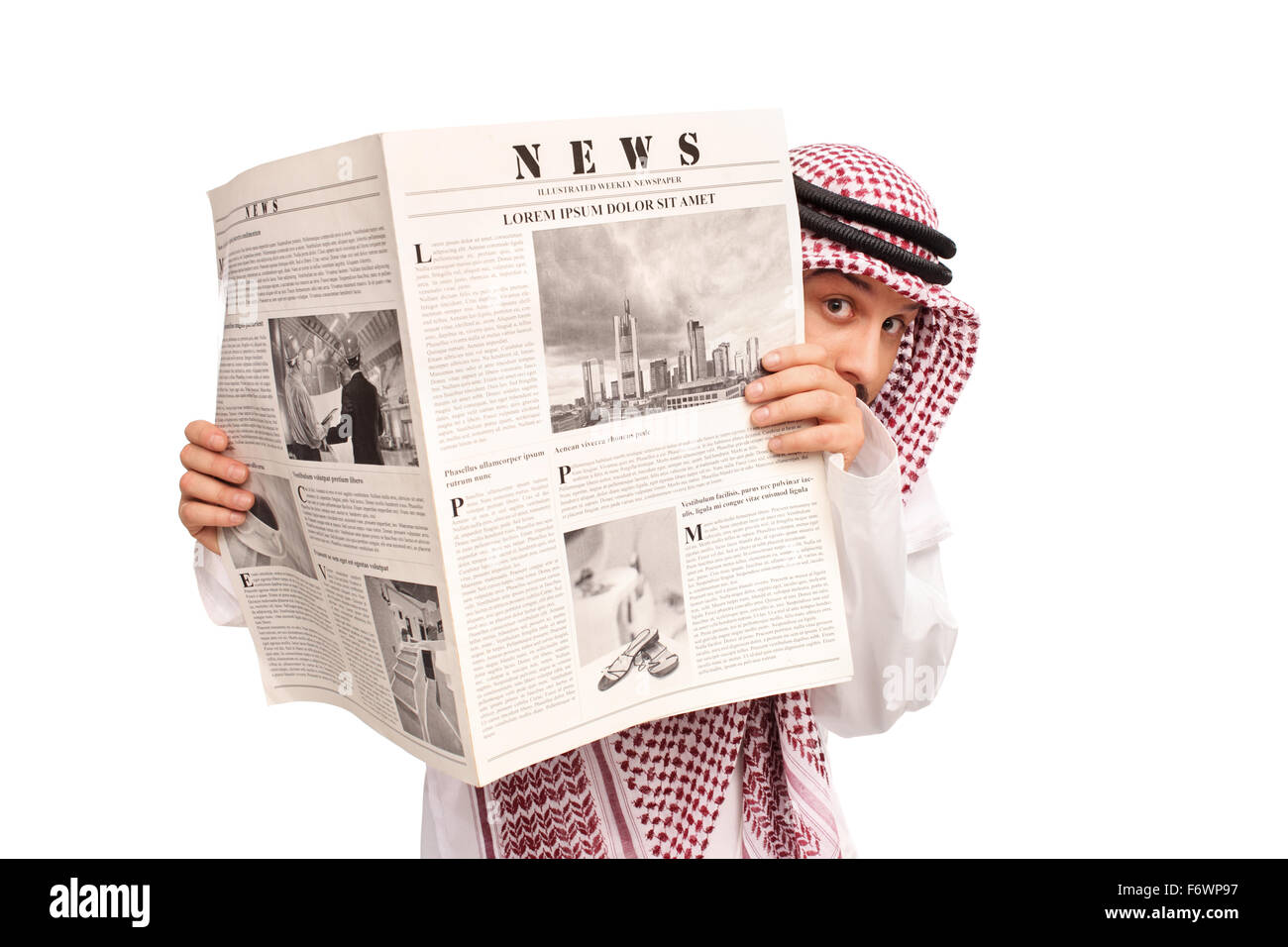Sacred young Arab hiding behind a newspaper and looking at the camera ...
