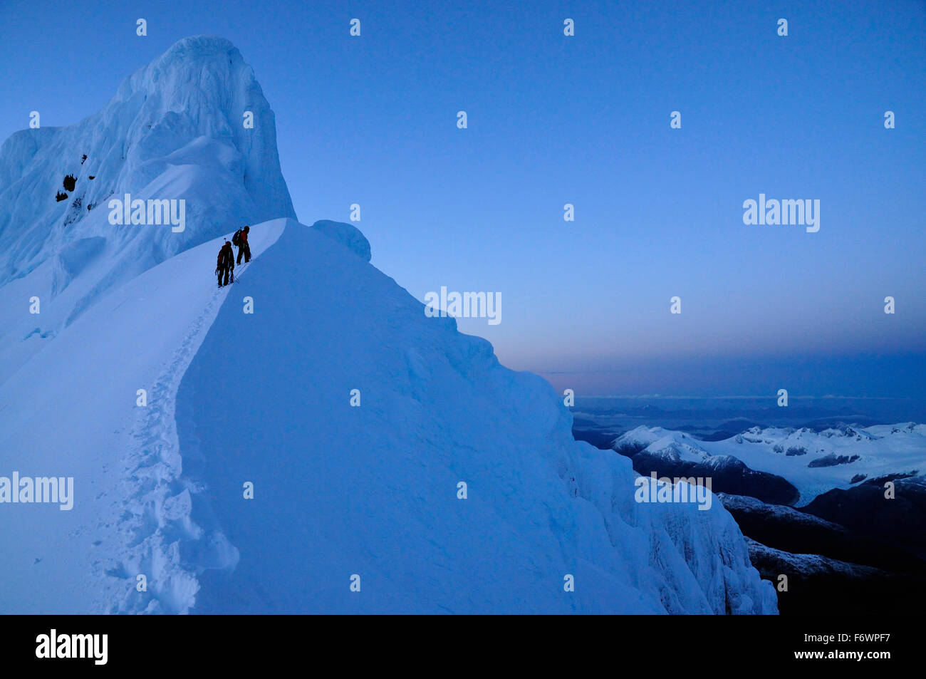 Two mountaineers below west summit of Monte Sarmiento, Cordillera ...