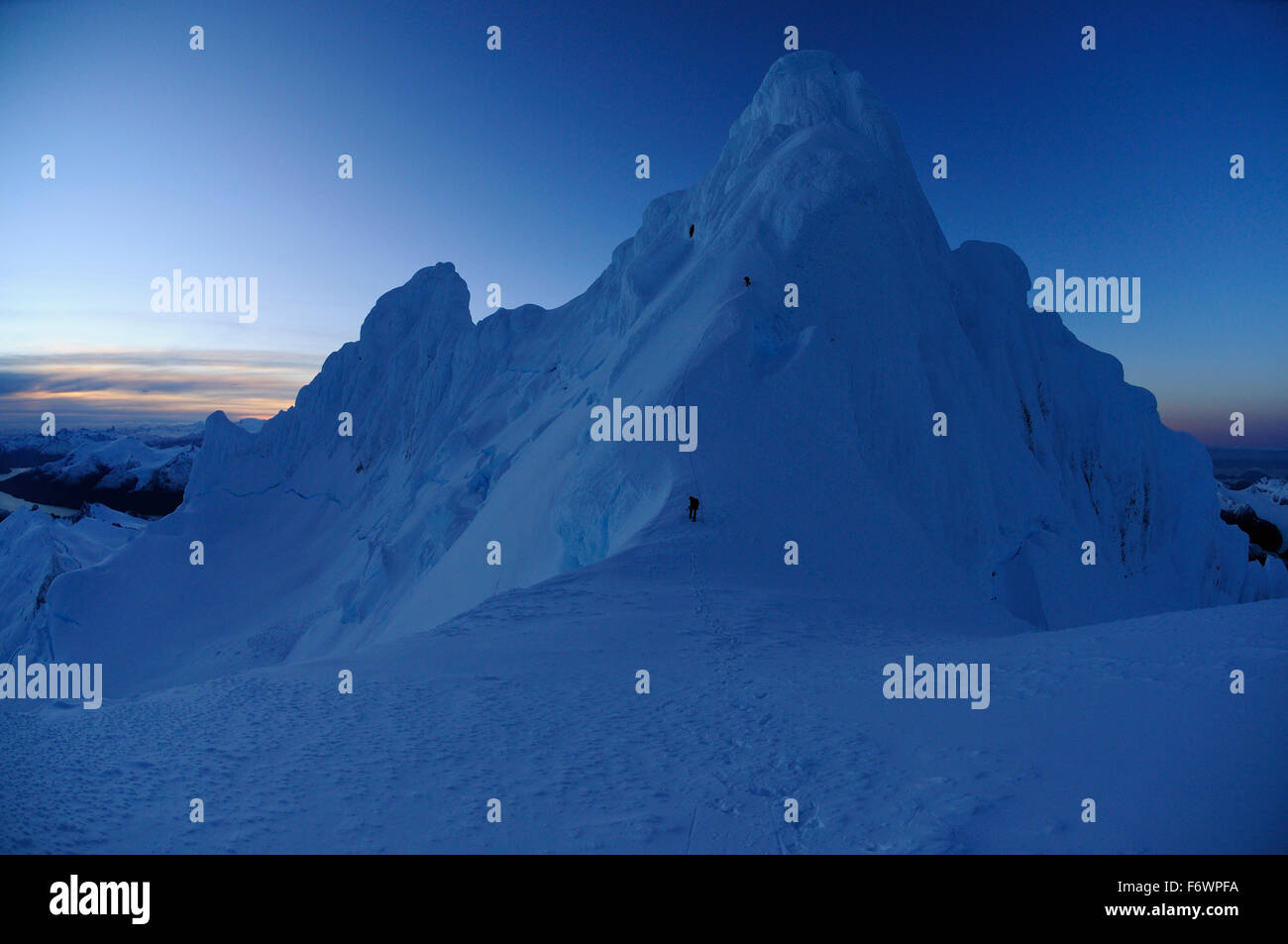 Two mountaineers below summit of Monte Sarmiento, Cordillera Darwin ...