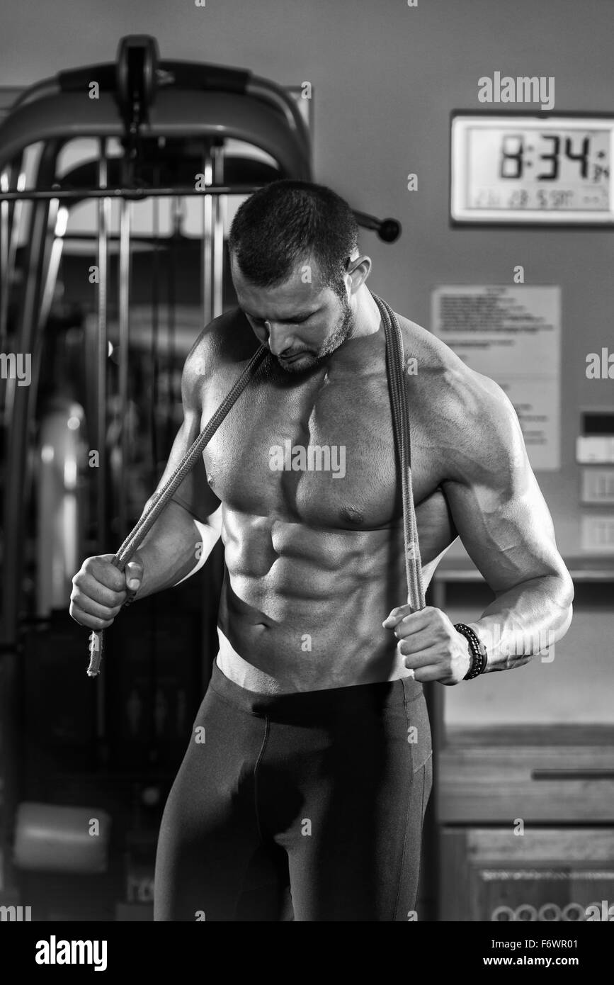 Handsome Muscular Man With Jumping Rope Stock Photo - Alamy