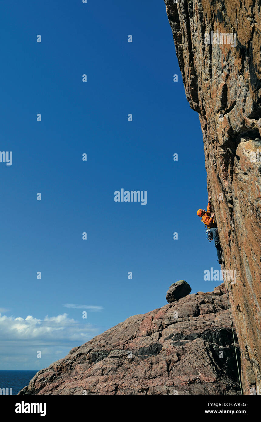 Man climbing in the cliffs of Sheigra, Highlands, Scotland, Great ...