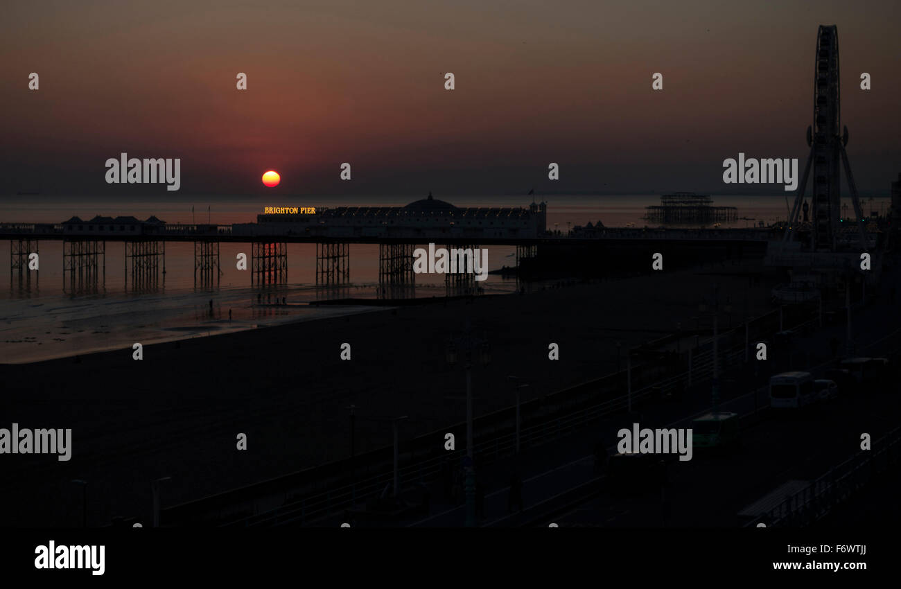 Sunset over Brighton Pier, showing the Brighton Wheel and the remains ...