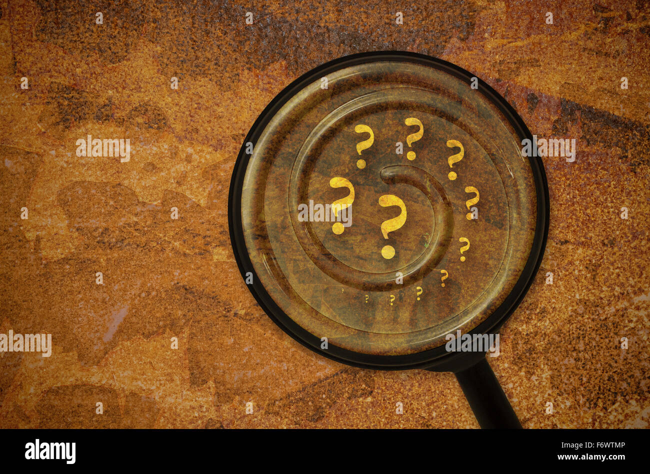 Several question marks written in a spiral under a magnifier Stock ...