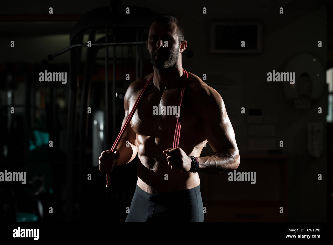 Handsome Muscular Man With Jumping Rope In Siluet Stock Photo - Alamy