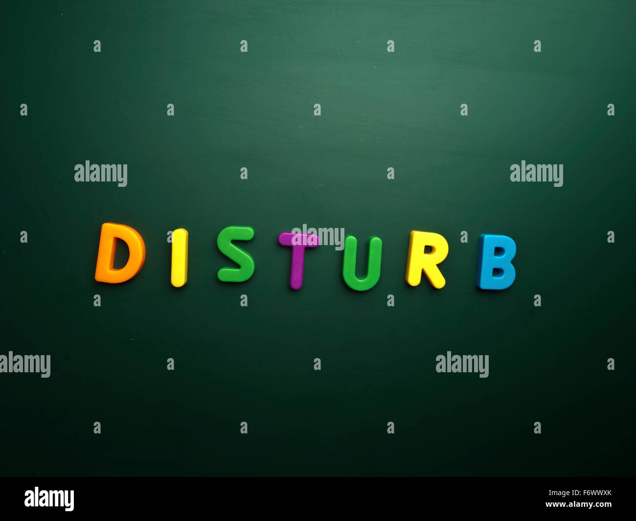 disturb concept in colorful letters isolated on blank blackboard Stock ...