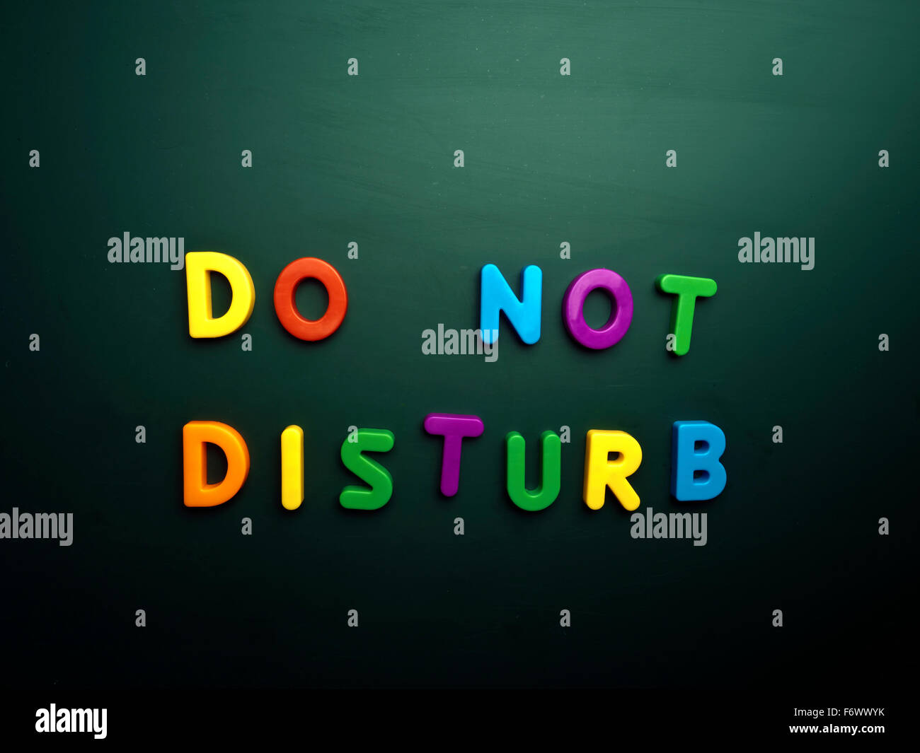 do not disturb concept in colorful letters isolated on blank blackboard ...