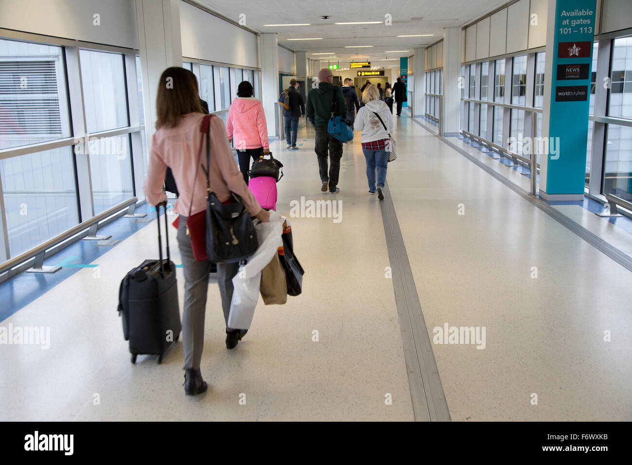 Passengers walking to departure gate at north terminal gatwick airport hi-res stock photography ...