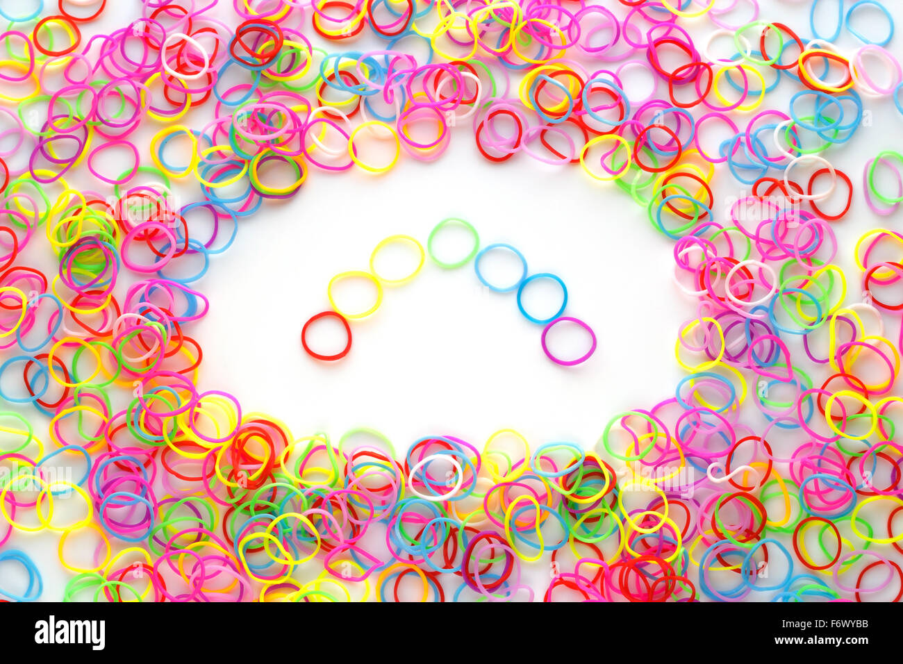 Colored rubber bands for weaving accessories on a white background ...