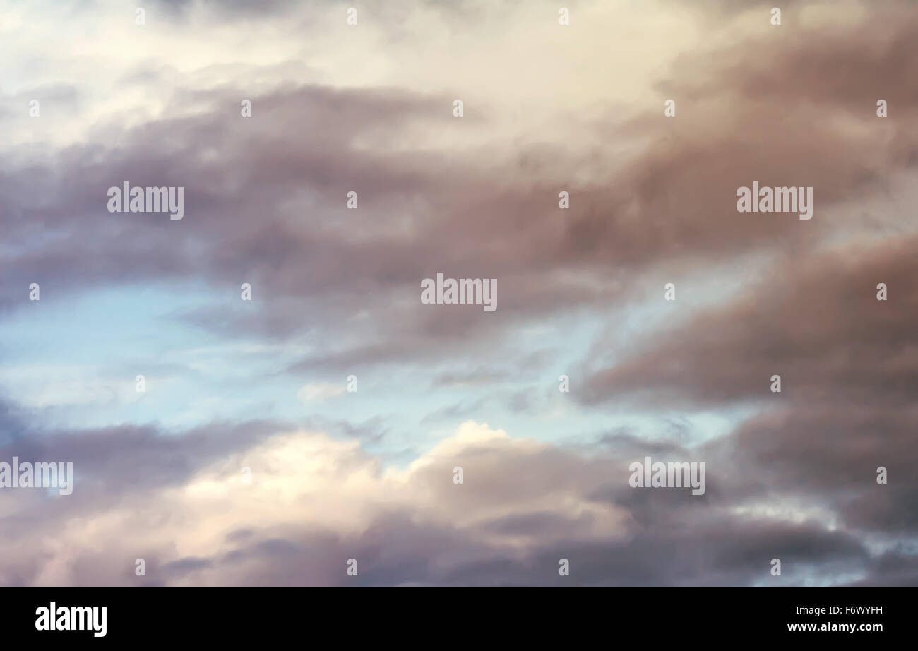 The autumn sky with dark rain clouds, between which are visible in the ...