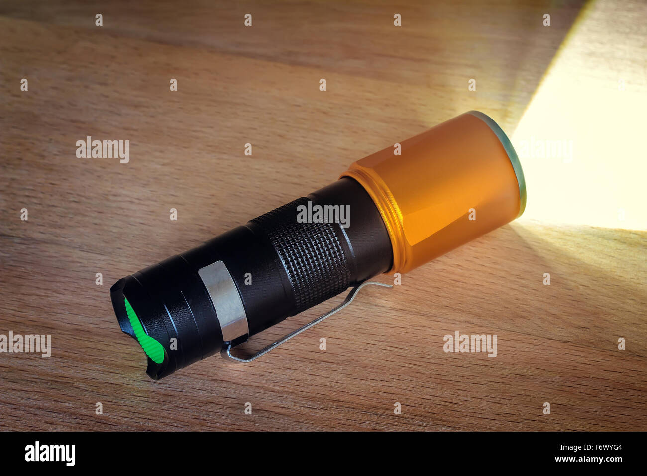 Included a small electric torch lying on the table surface. From it ...