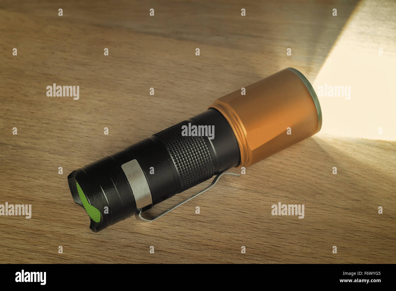 Included a small electric torch lying on the table surface. From it ...