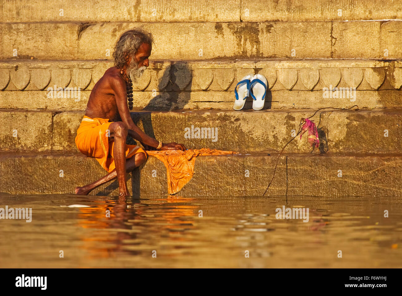 Indian man washing clothes on hi-res stock photography and images - Alamy