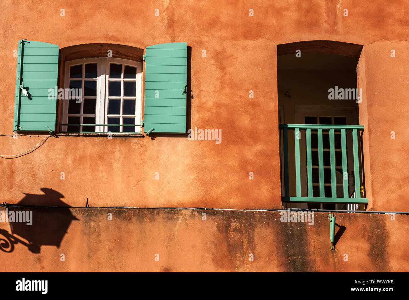 Sunbaked building detail window and balcony Stock Photo - Alamy