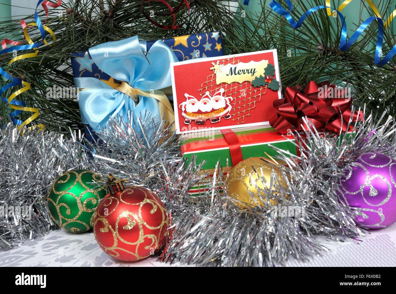 A few gifts at Christmas with a card, balloons and tinsel Stock Photo ...