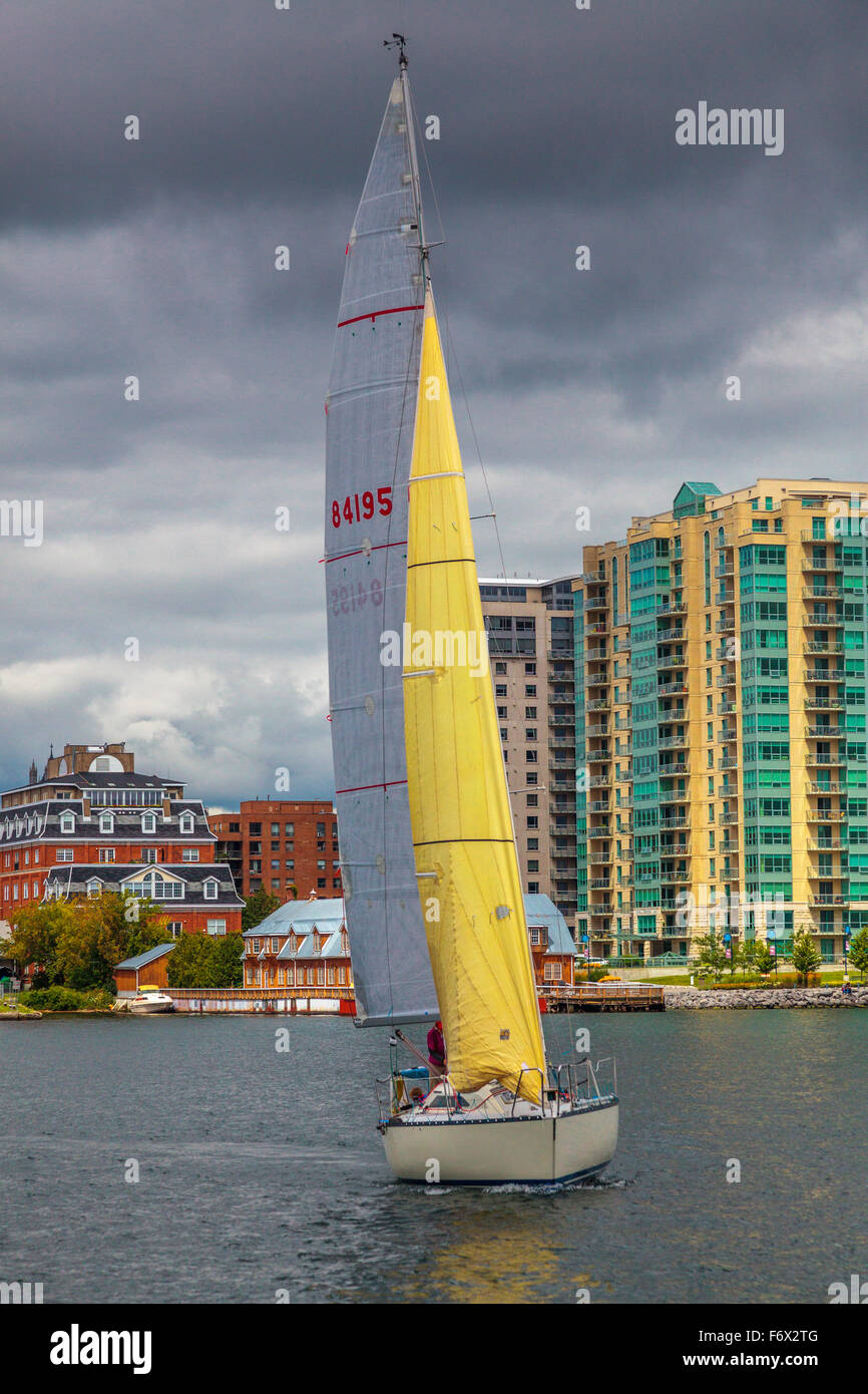Boat with yellow sail at Kingston Ontario Stock Photo - Alamy