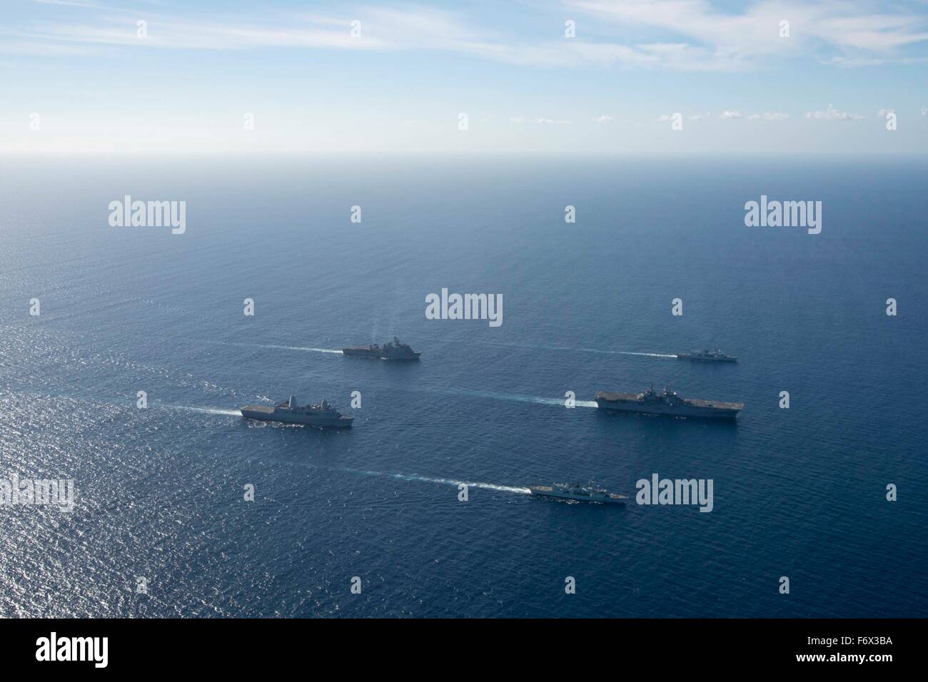 US Navy amphibious assault ship USS Boxer steams in formation along ...