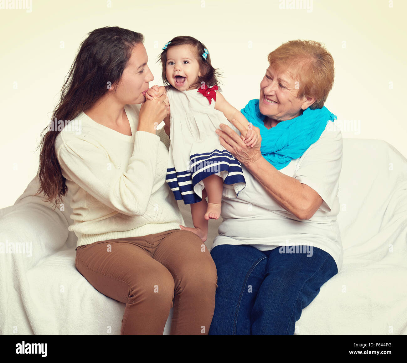 happy family portrait - baby, woman and old lady on white Stock Photo ...