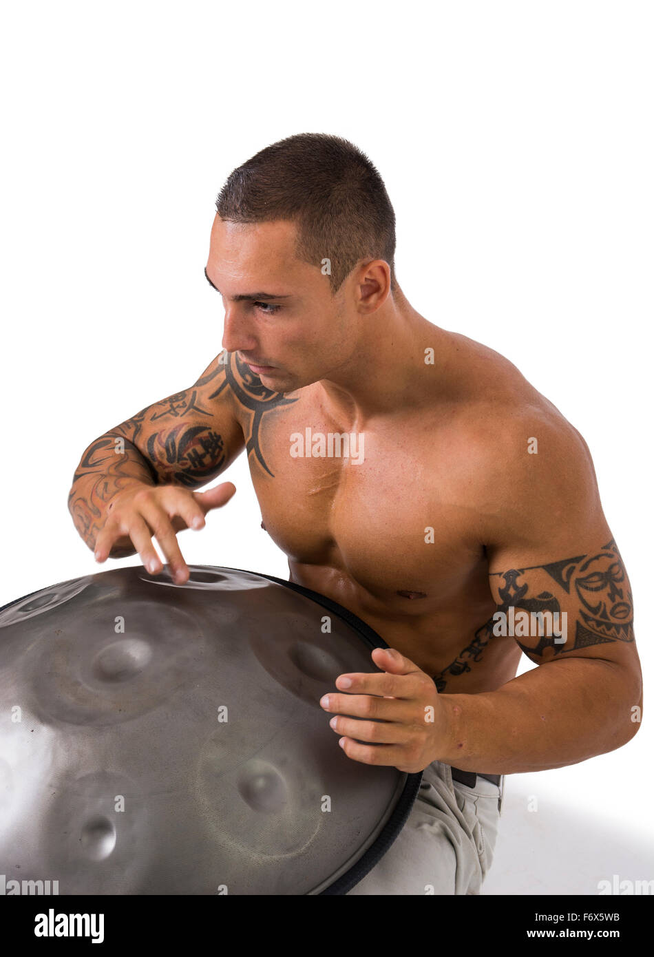 Exotic Male Drummer Drumming with Hands on Steel Pan Drums, While ...