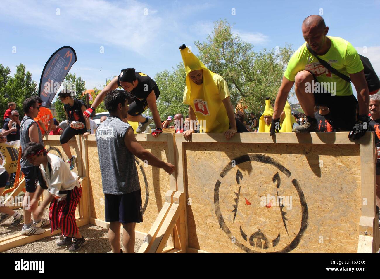 SIGNA, ITALY - MAY 9 2015: Group of people dresssed as bananas jumping ...