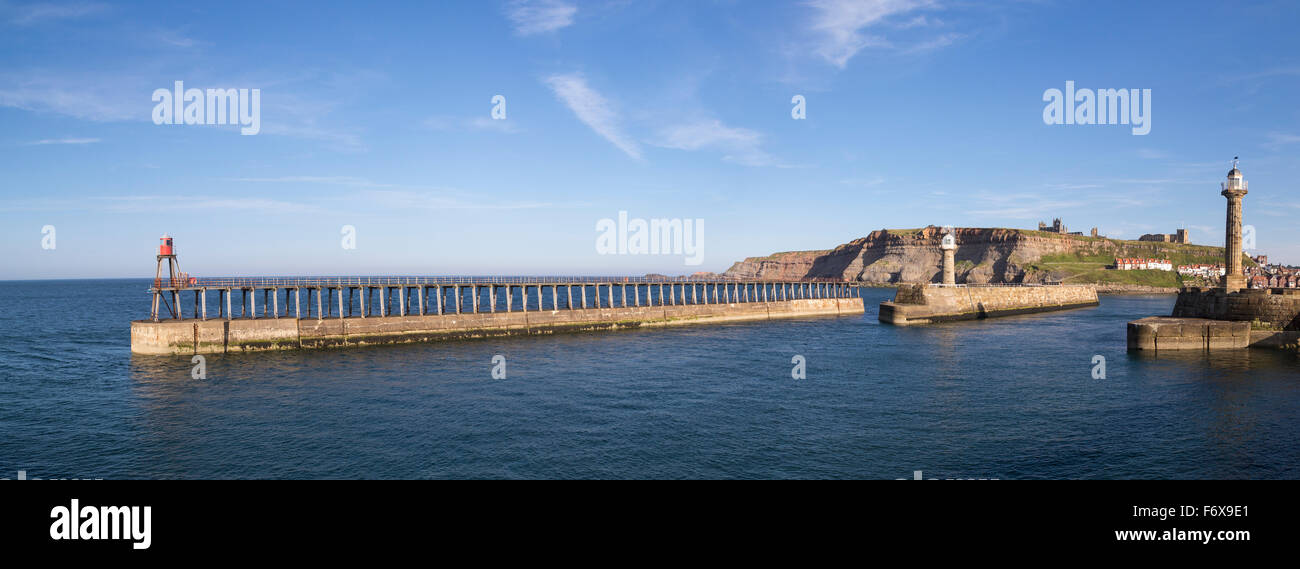Lighthouse and breakwater wall in the harbour; Whitby, North Yorkshire ...