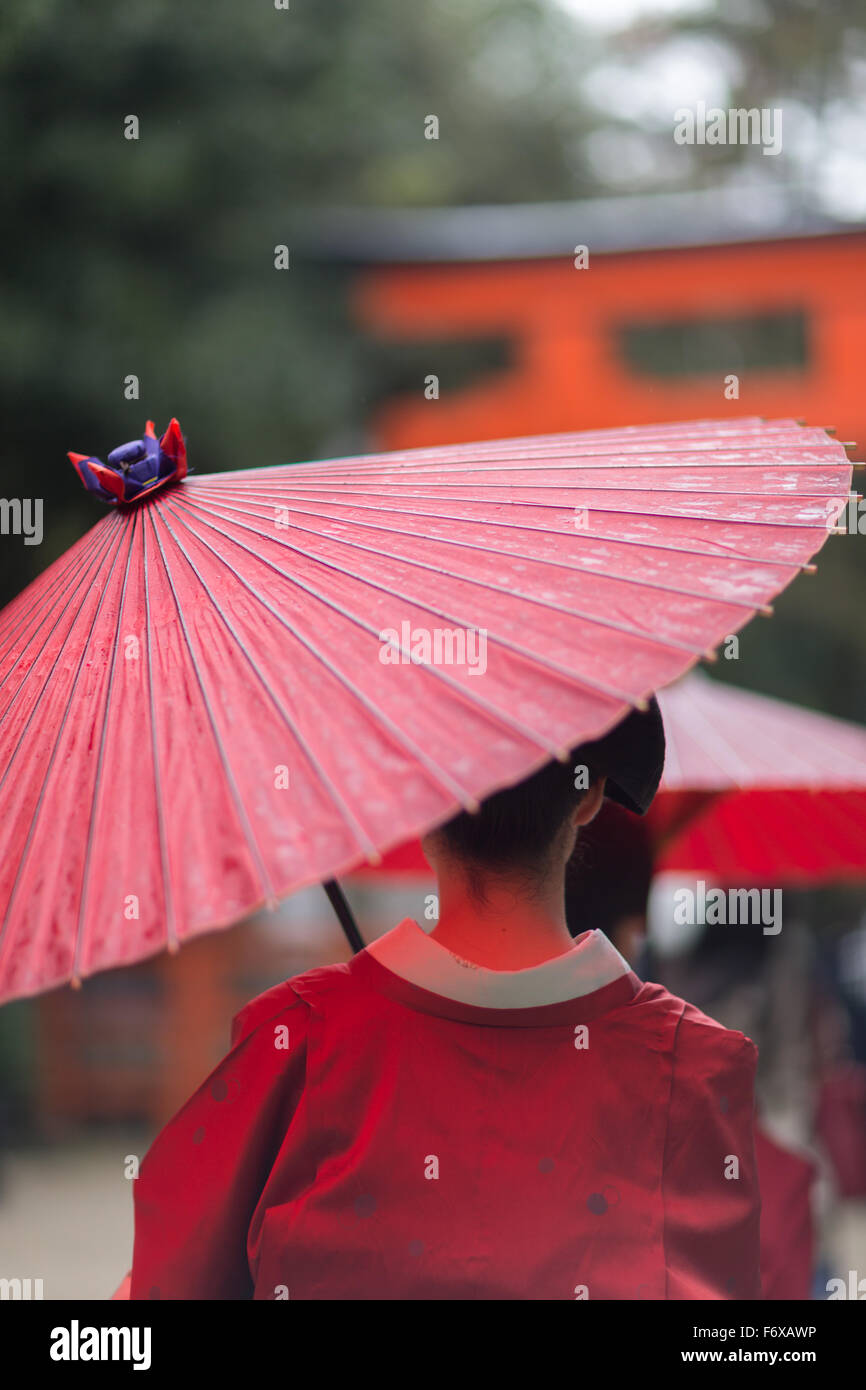 Japan Kyoto Traditionally dressed woman holding traditional wagasa oil ...