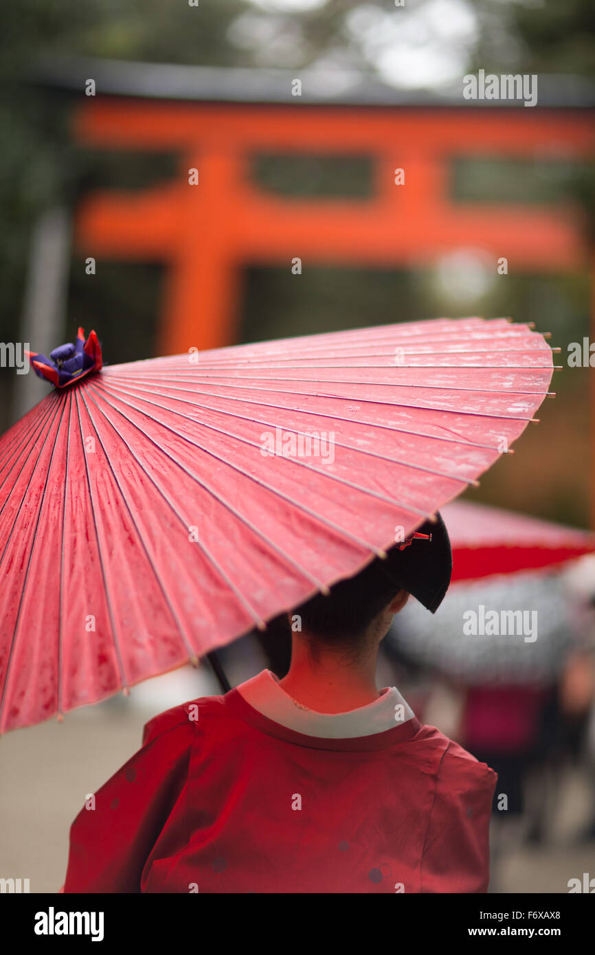 Japan Kyoto Traditionally dressed woman holding traditional wagasa oil ...