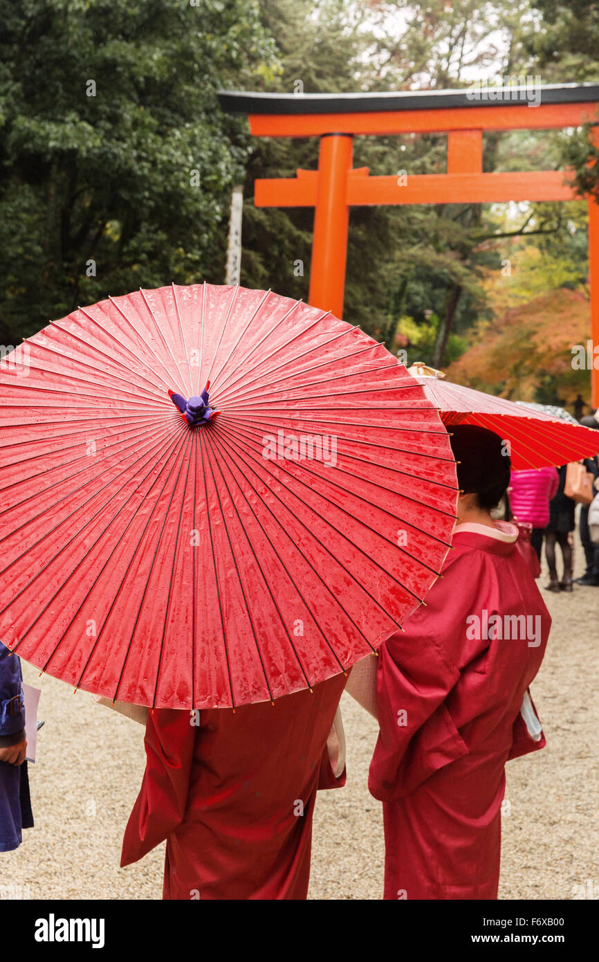 Japan Kyoto Two traditionally dressed female figures figures holding ...